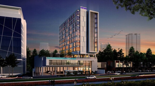 Um hotel moderno com um destaque para o letreiro 'ASTON', vários andares e uma entrada bem iluminada.