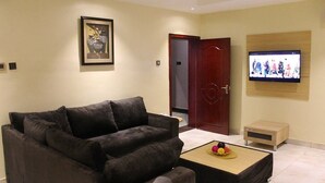 Quarto Executivo | Sala de estar | TV de ecrã plano 
