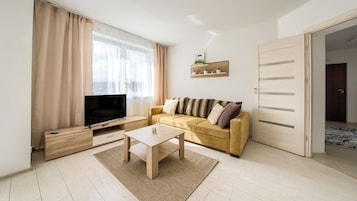 Apartamento (7B/3) | Área de estar | TV de tela plana