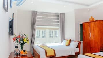 Quarto Quádruplo Deluxe | Minibar, Wi-fi grátis