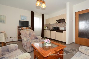 Apartamento (Strandhus 4) | Sala de estar | TV