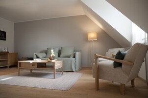 Suite Deluxe | Sala de estar | Televisor 