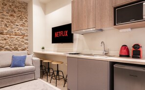 Duplex executivo (Maisonette) | Sala de estar | TV de tela plana 40 polegadas com canais digitais, smart TV, Netflix