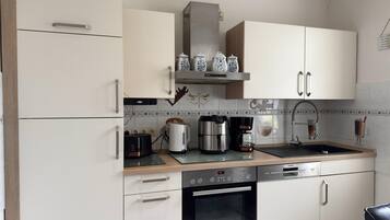 Apartamento | Cozinha privada | Torradeira, cadeirão de bebê