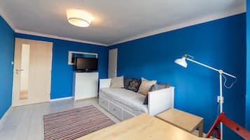 Apartamento Comfort | Sala de estar | TV de ecrã plano