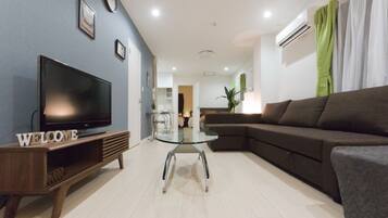 Suíte, várias camas, para não fumantes, vista para a cidade (Room, 101) | Área de estar