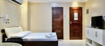 Quarto superior | Cortinas blackout, Wi-Fi de cortesia, roupa de cama