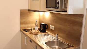 Quarto casal ou duplo | Cozinha americana privada | Geladeira grande, micro-ondas, cooktop, cafeteira/chaleira