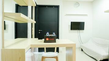 Quarto | Área de estar | TV