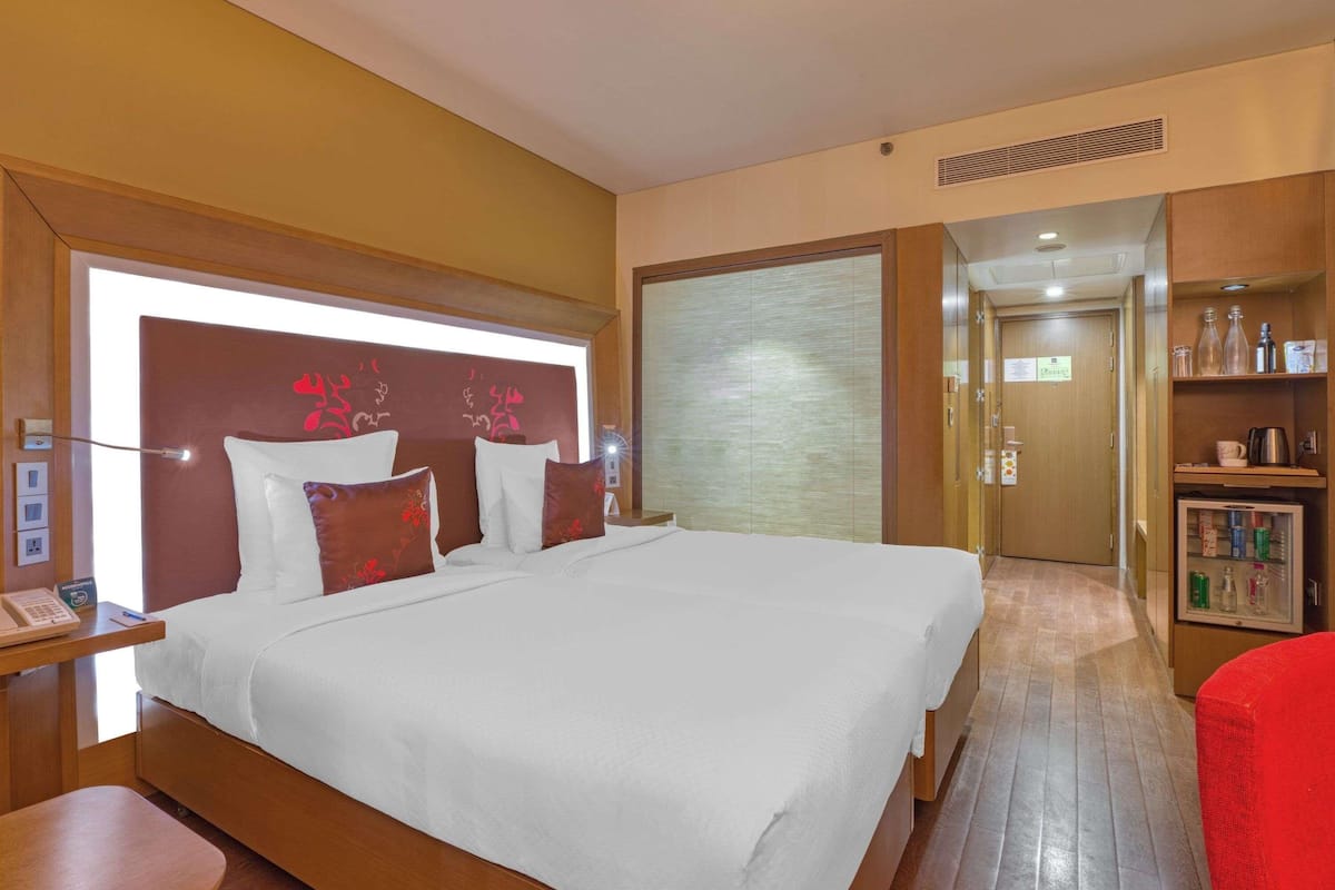 Roupas de cama premium, edredons de pluma, frigobar, cofres nos quartos