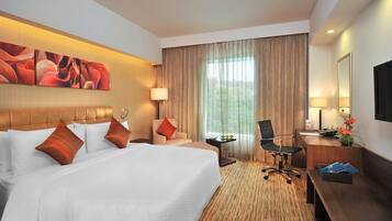 1 quarto, camas de colchão pillowtop, minibar