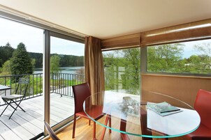 Suite Majestueuse, 1 chambre | Área de estar | TV de tela plana