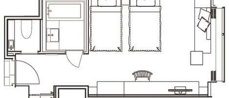Planta baixa de um quarto de hotel com banheiro, uma pequena área de estar e uma cozinha compacta.