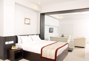 Suíte, 1 cama King | Frigobar, cofres nos quartos, Wi-Fi de cortesia, despertadores