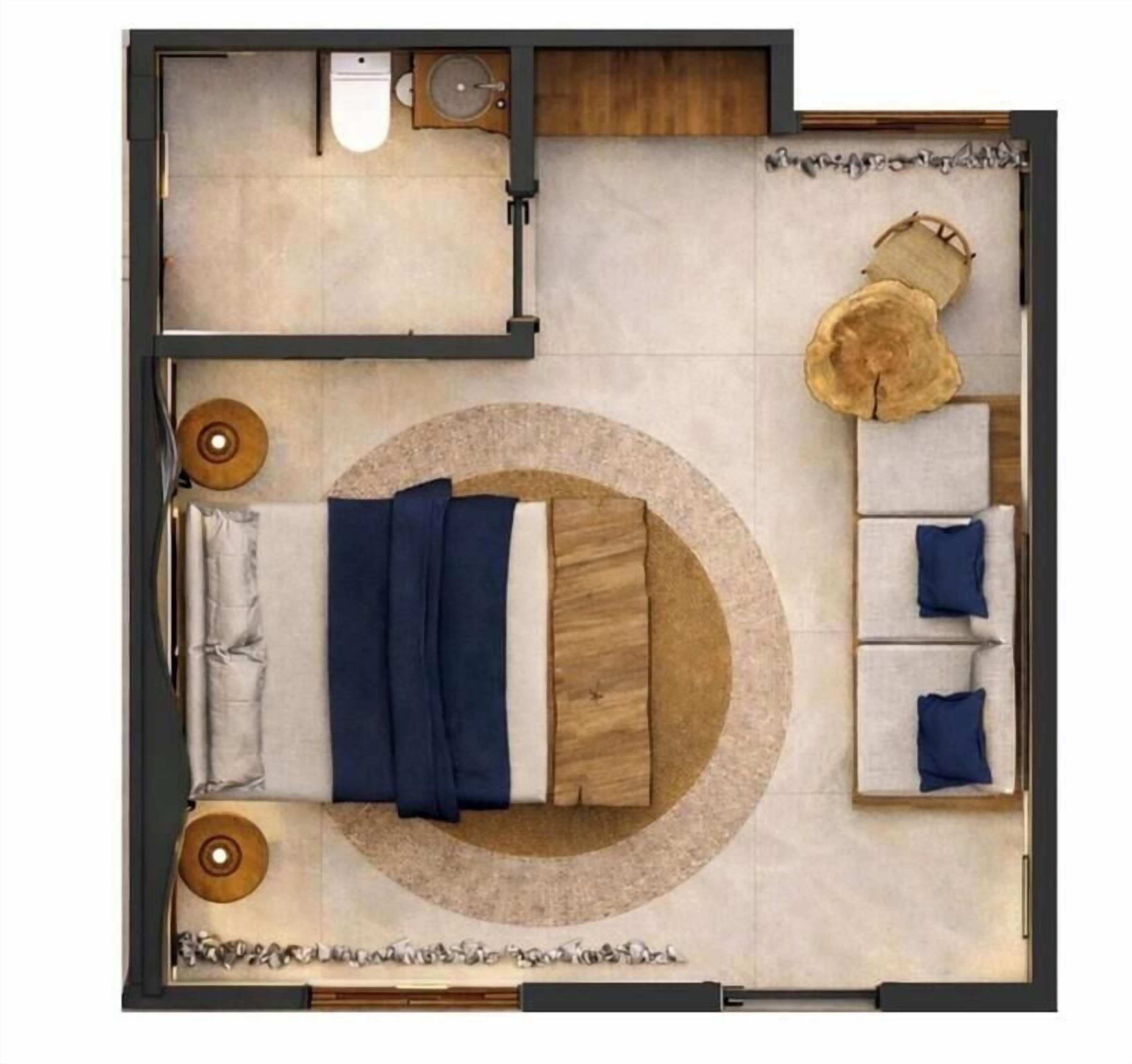 Um quarto com uma cama, uma área de estar com almofadas, uma mesinha e um móvel de madeira.