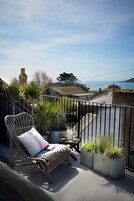 Apartamento superluxo, 1 quarto, lareira, vista para o mar | Terraço/pátio