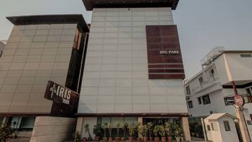 A modern building with a sign reading "IRIS PARK".