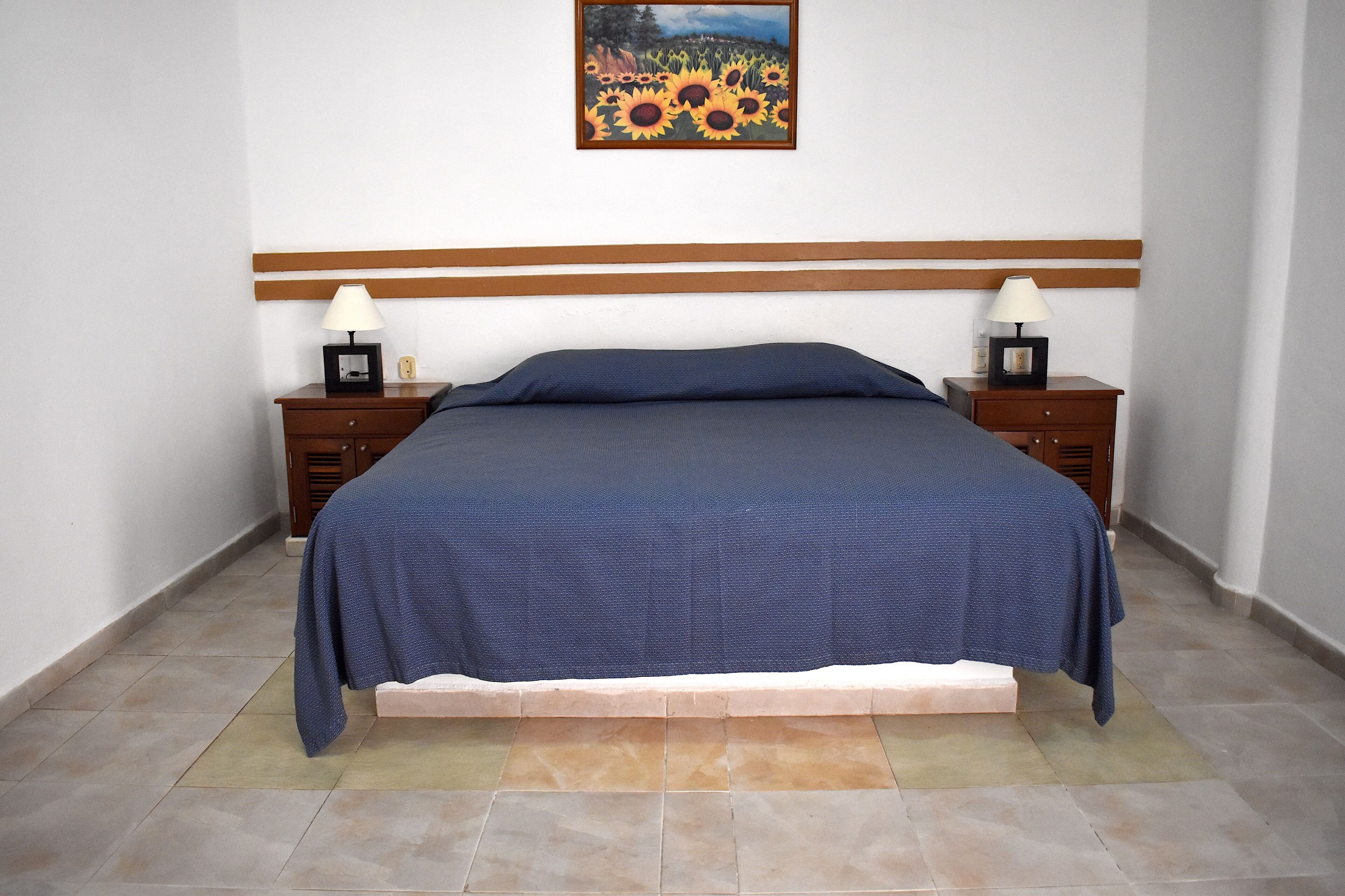 Quarto standard, 1 cama King | Frigobar, cofres nos quartos, cortinas blackout