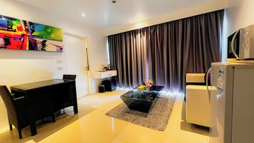 Suite, 2 quartos | Sala de estar | Televisor LCD