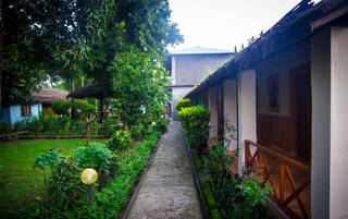 Quarto casal conforto, vista para o jardim | Fachada