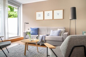 Apartment Suite (exklusive 75 EUR Reinigungsgebühr) | Área de estar | TV de tela plana, filmes recentes