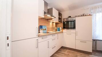 Apartamento | Cozinha privada | Geladeira, fogão, cooktop, lava-louças