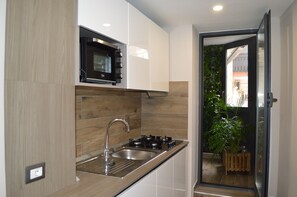 Quarto Quádruplo Clássico | Cozinha privada | Minifrigorífico, uma chaleira elétrica