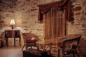 Suíte superior | Área de estar | TV de tela plana