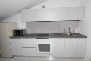 Apartamento | Cozinha privada | Geladeira