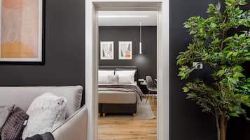 Apartamento Superior, 1 quarto | Sala de estar | Televisor LCD