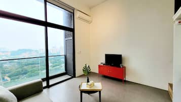 Loft urbano | Área de estar | TV de tela plana