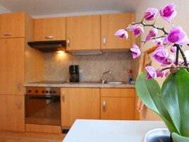 Apartamento | Cozinha privada | Cadeirão de bebê