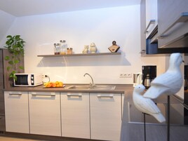 Apartamento | Cozinha privada | Cadeirão de bebê