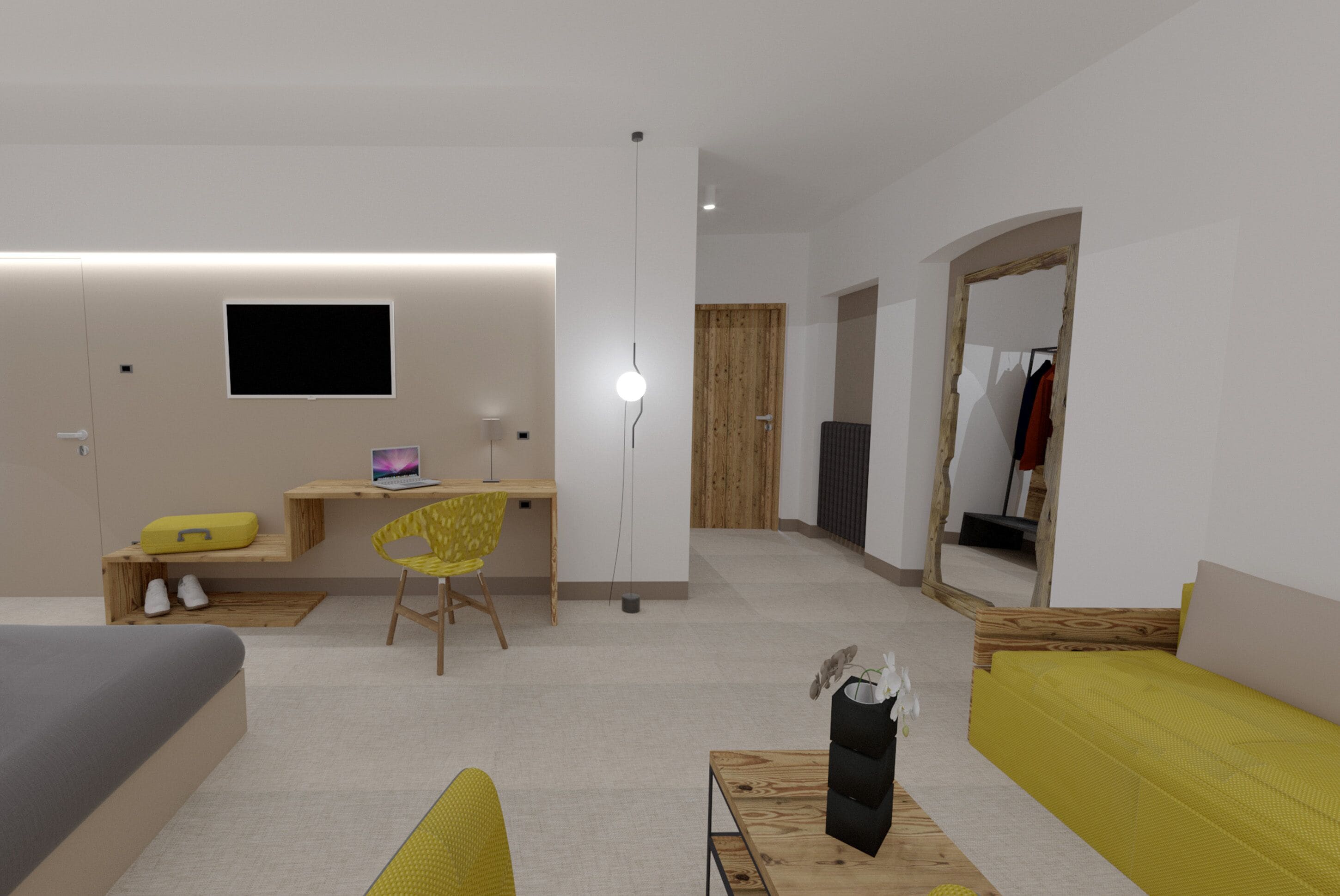 Quarto de hotel moderno com uma cama, uma escrivaninha com computador, uma cadeira, uma pequena mesa com um vaso e um espelho.