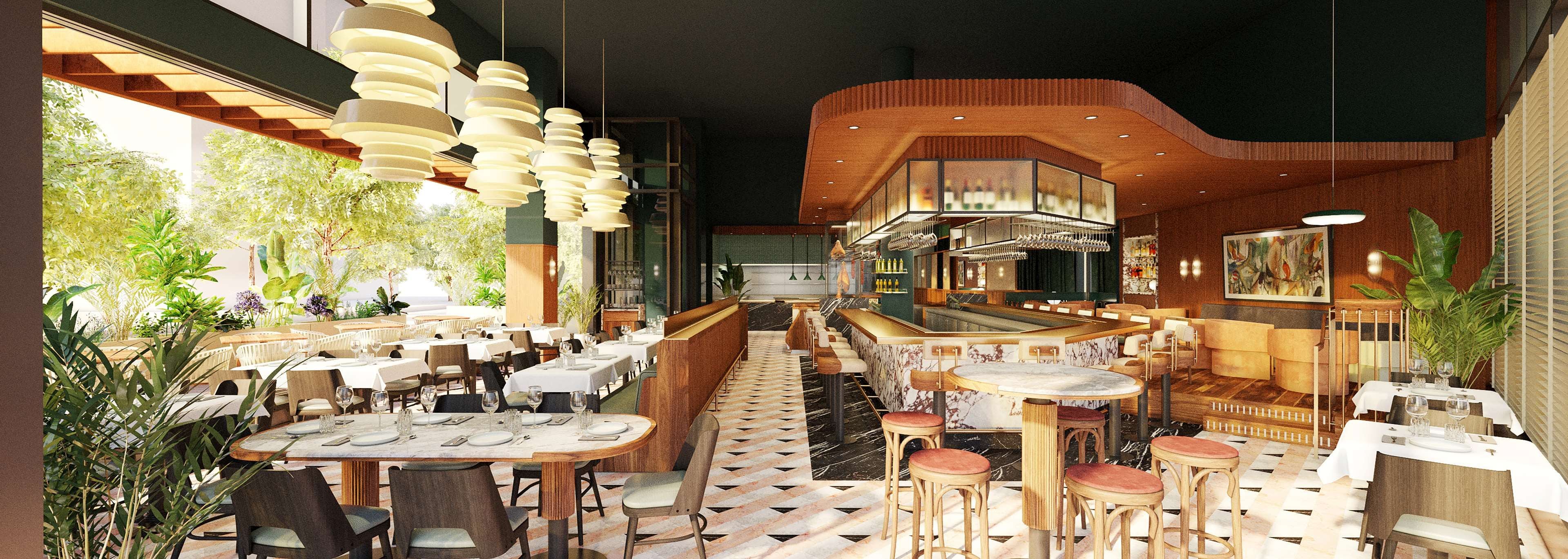 Restaurante com várias áreas de refeições, bar e vista para o verde lá fora.