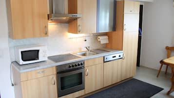 Chalé | Cozinha privada | Uma cadeira de bebé