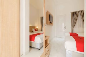 Quarto Twin | Roupa de cama fornecida