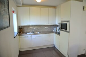 Apartamento | Cozinha privada | Cadeirão de bebê