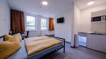 Estúdio básico, 1 cama Queen | Wi-Fi de cortesia, roupa de cama