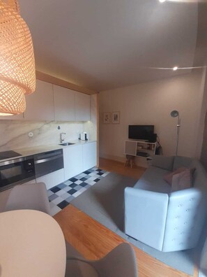 Apartamento Signature | Sala de estar | Televisor 