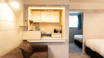 Quarto Familiar | Minibar, cortinas/cortinados opacos, Wi-fi grátis