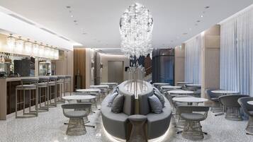 Uma área de estar moderna com disposição central, bar e iluminação ambiente.
