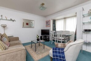 Apartamento | Área de estar | TV
