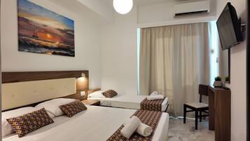 Quarto Triplo Standard, Vista para a cidade | Quartos insonorizados, Wi-fi grátis, roupa de cama fornecida