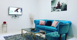 Apartamento Comfort | Sala de estar | Televisor