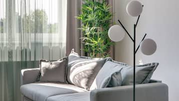 Suite XXL + sofa bed | Área de estar | Smart TV 55 polegadas com canais digitais, TV