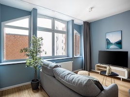 Suite XL + sofa bed | Área de estar | TV de tela plana 125 cm com canais digitais, TV