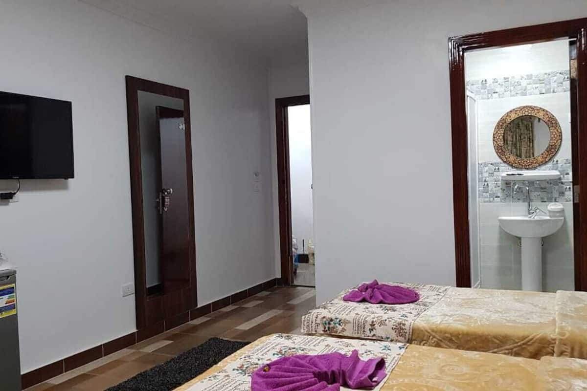 1 quarto, roupa de alta qualidade, camas de colchão pillowtop, minibar