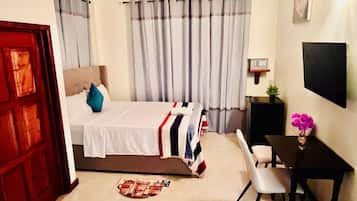 Quarto Deluxe | Ferro/tábua de engomar, Wi-fi grátis, roupa de cama fornecida