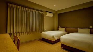 Cortinas blackout, Wi-Fi de cortesia, roupa de cama